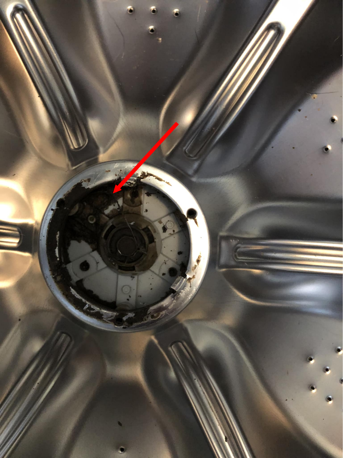 Black Flakes in Washing Machine: Causes & Fixes - SimplySwider.com